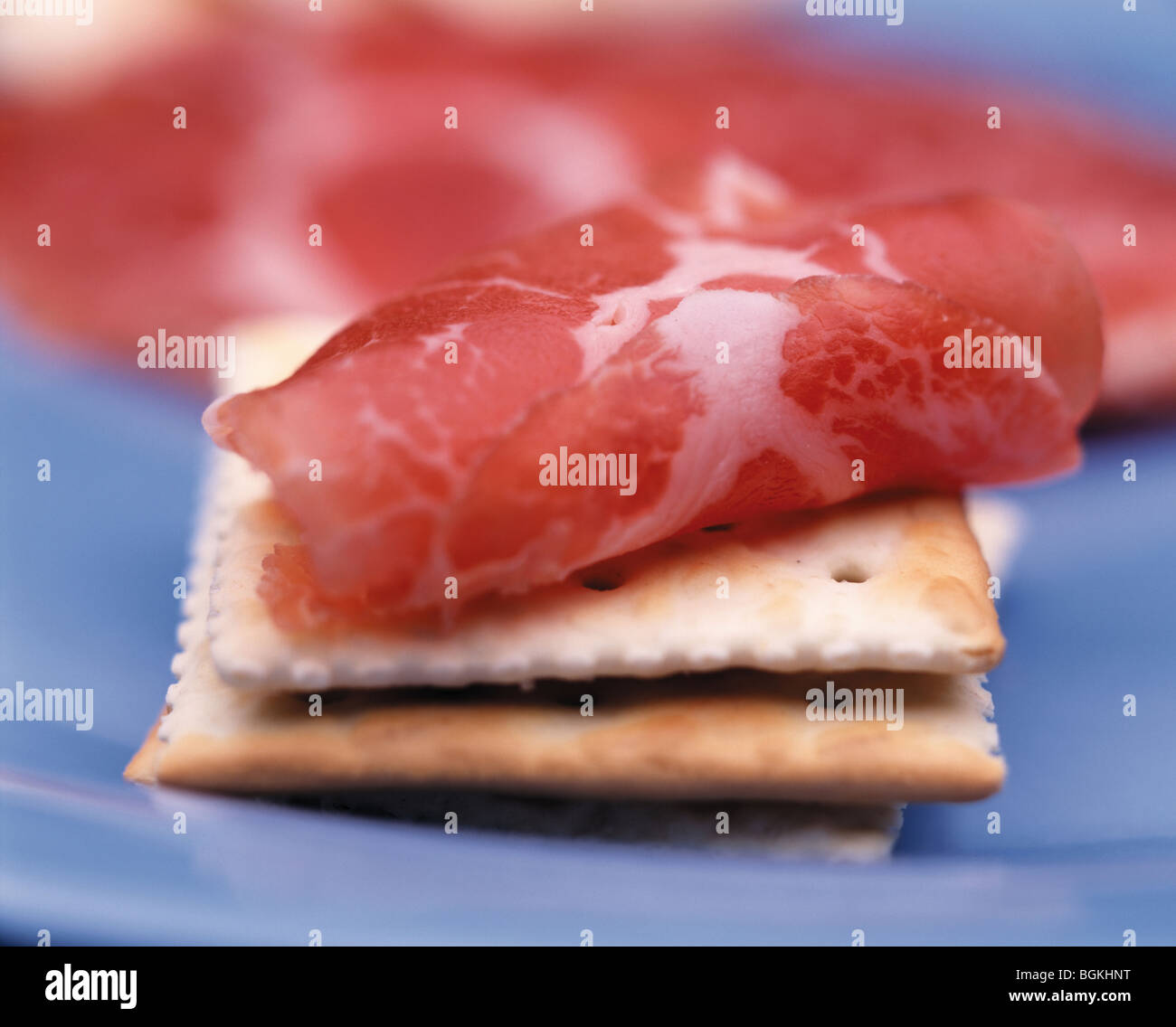 Ham slice on crackers Stock Photo - Alamy