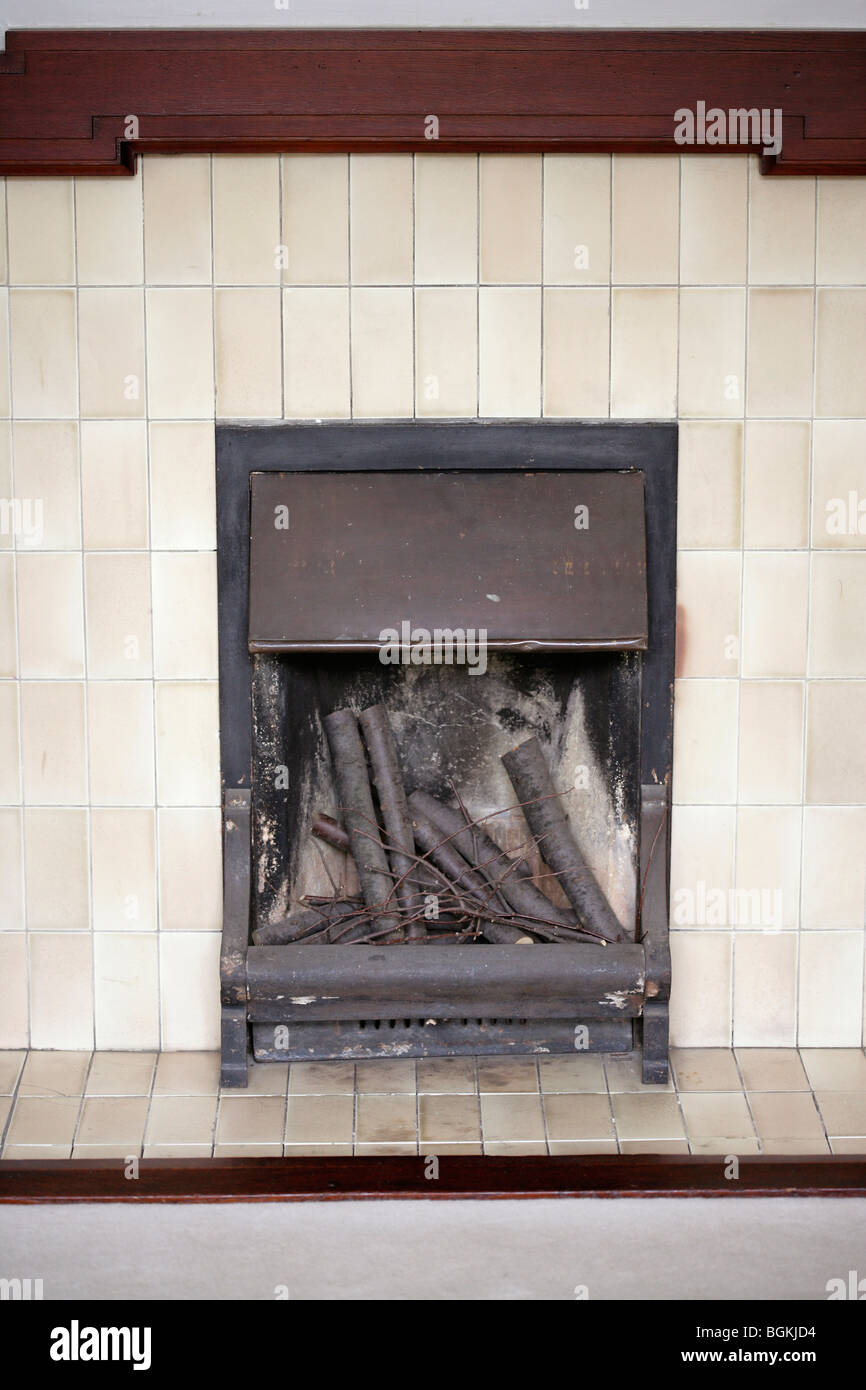 Fireplace with wood ready to be lit Stock Photo - Alamy