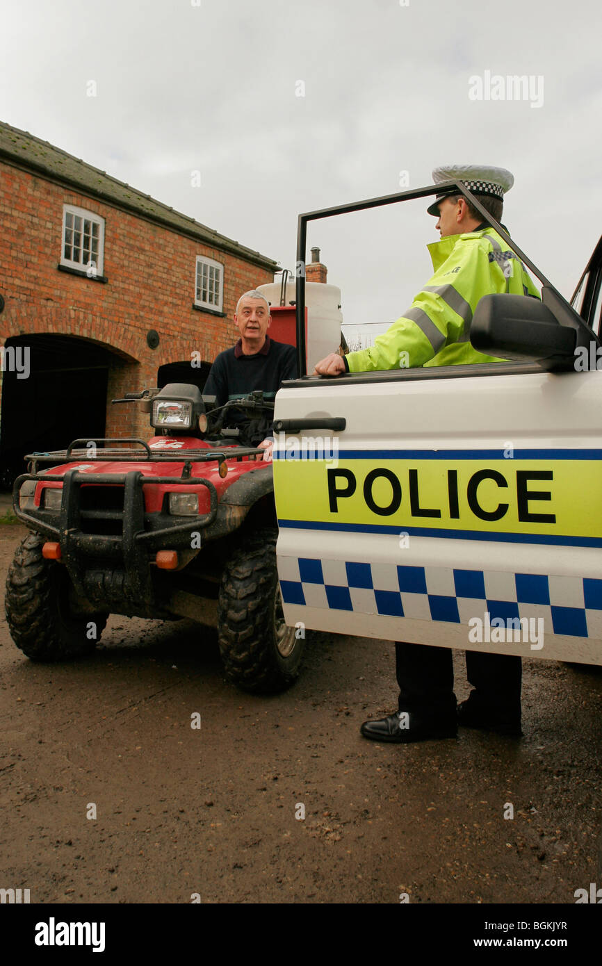 Police Officer Talking To A Farmer Stock Photo - Alamy