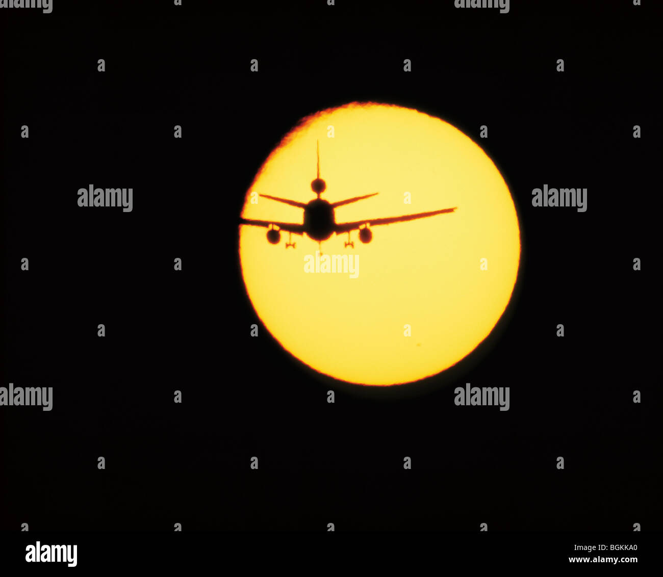 Airplane and sun Stock Photo - Alamy