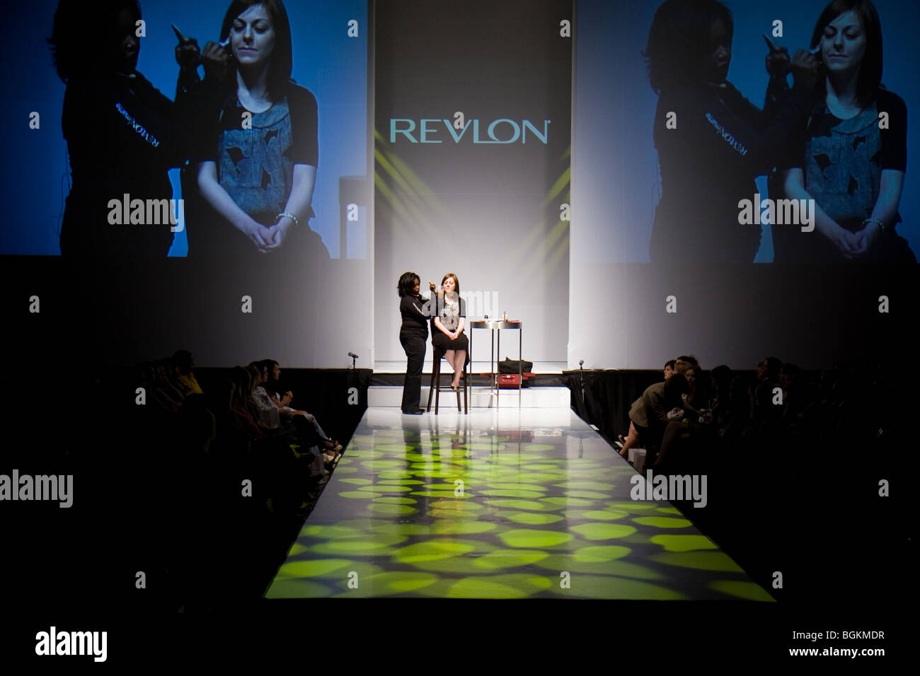 Revlon rep demonstrating make up technique at the Elle Fashion and ...