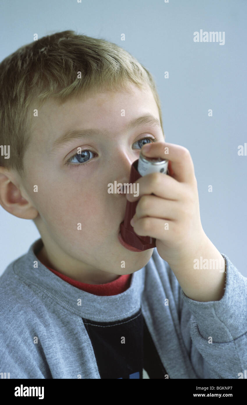 Boy taking inhaler Stock Photo - Alamy