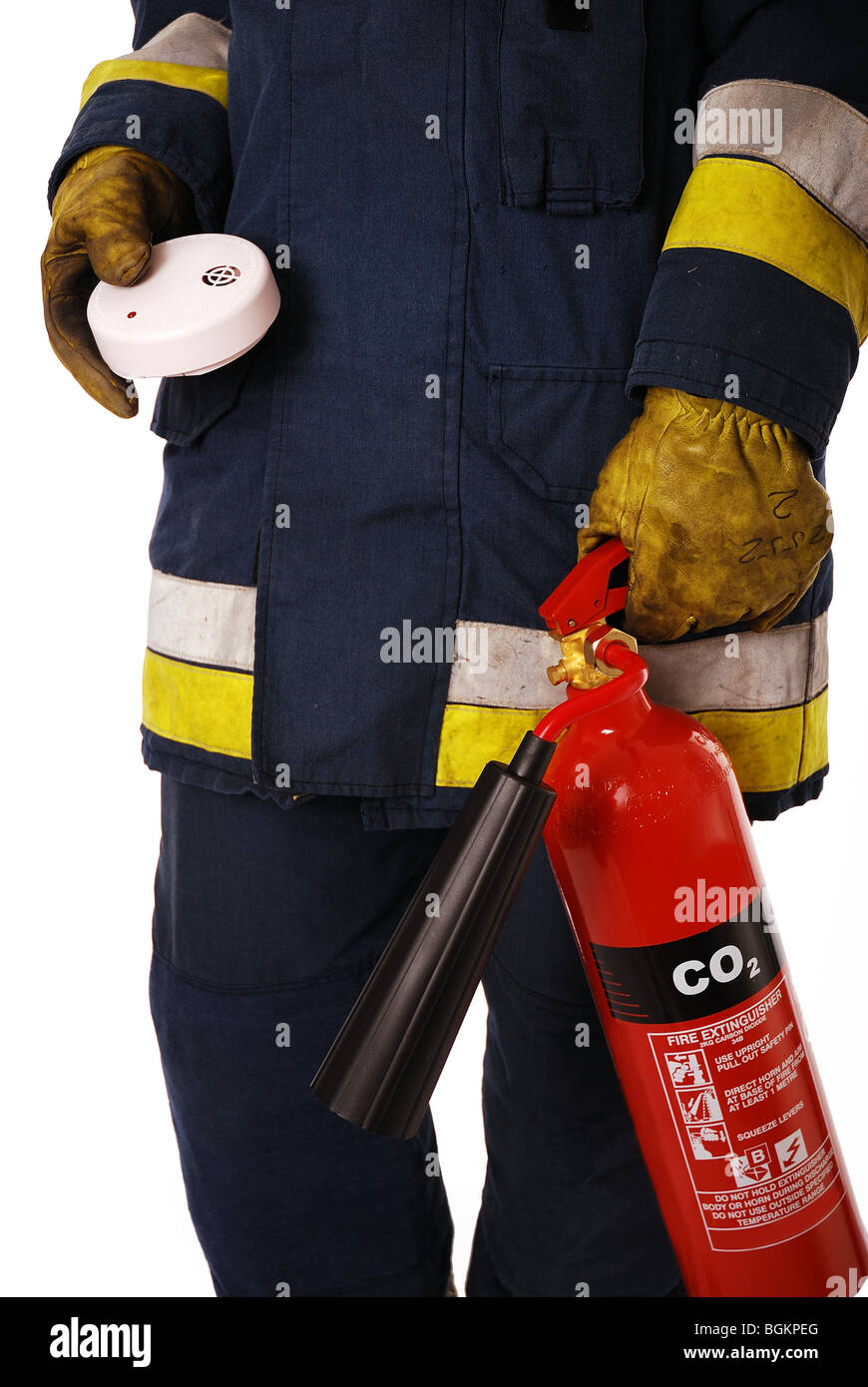 Firefighter holding fire safety equipment Stock Photo - Alamy