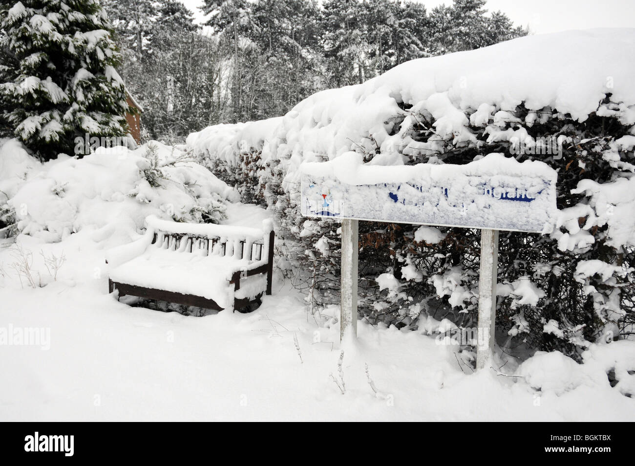 The sign at a closed school with a bench. Closed due to snow Stock ...