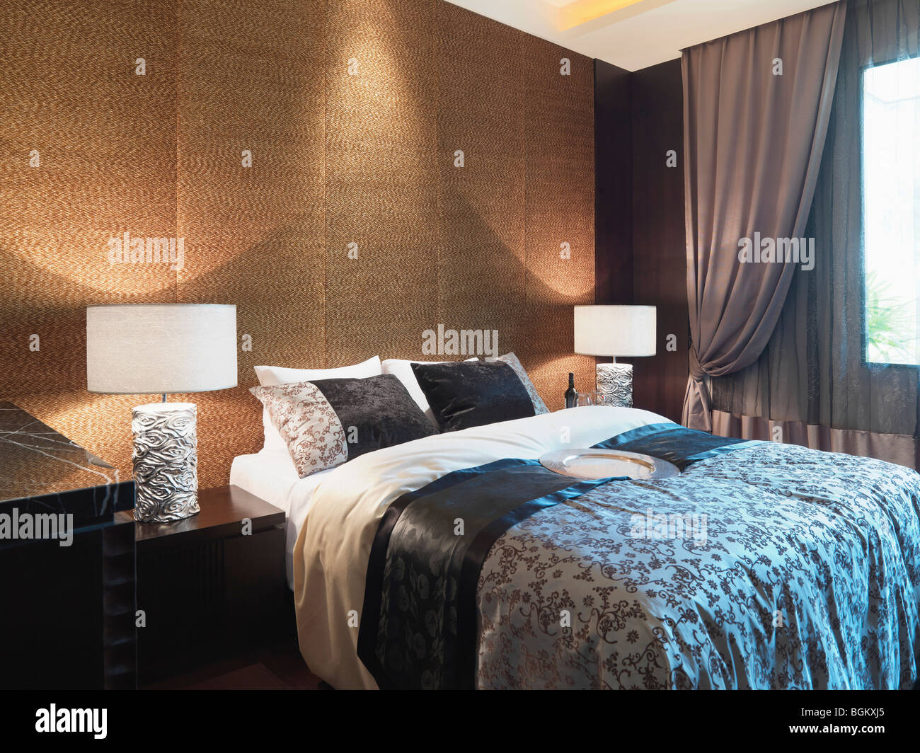 Textured wall behind bed Stock Photo - Alamy