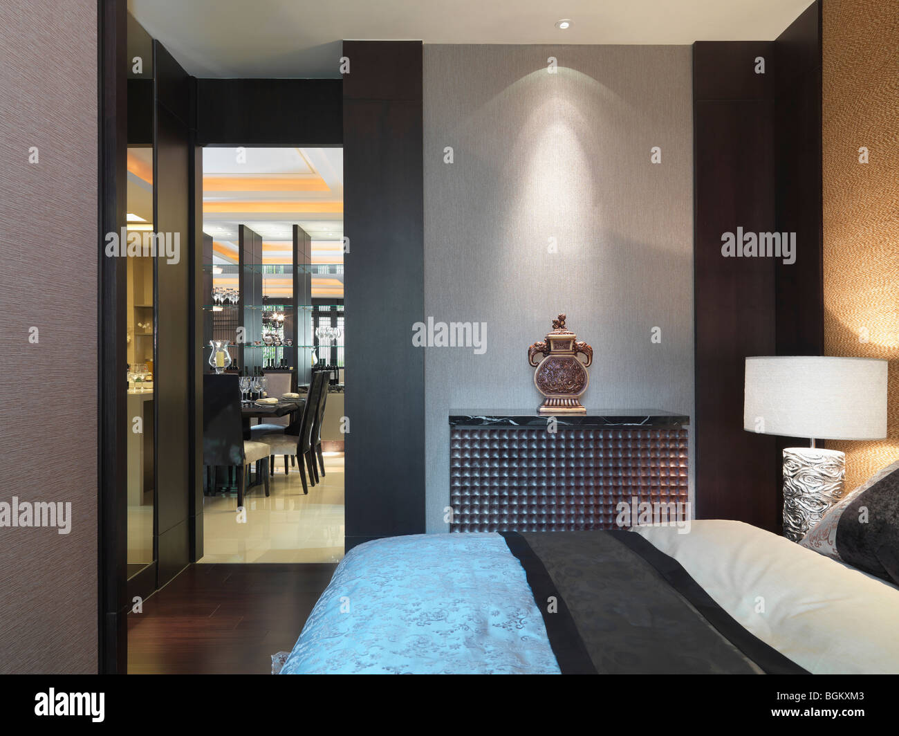 Bed and doorway in modern bedroom Stock Photo - Alamy