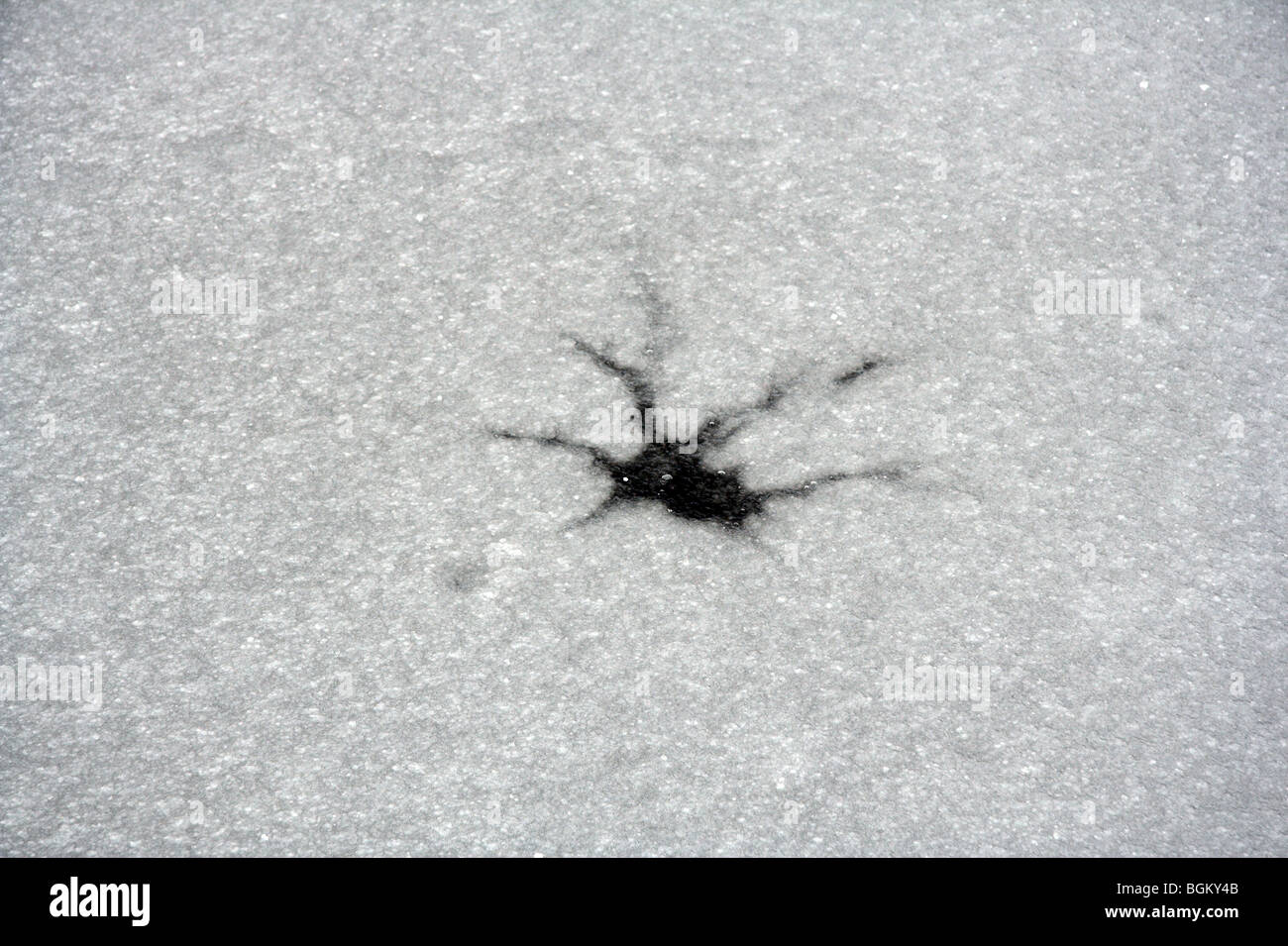 Hole in frozen ice of a lake, Alexandra Park, Moss Side, Whalley Range ...