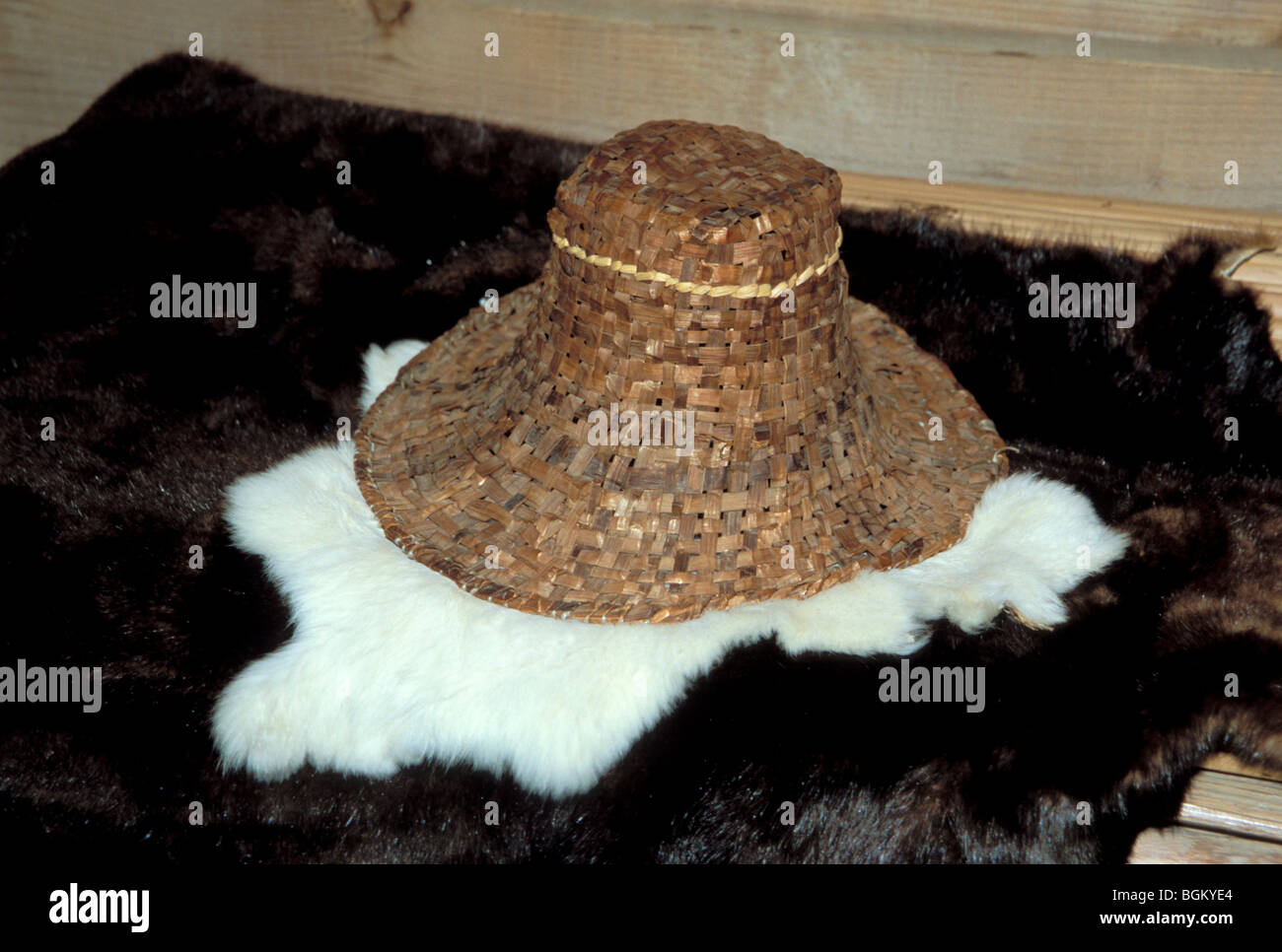 Conical cedar woven hat on animal furs worn by the Suquamish people and ...