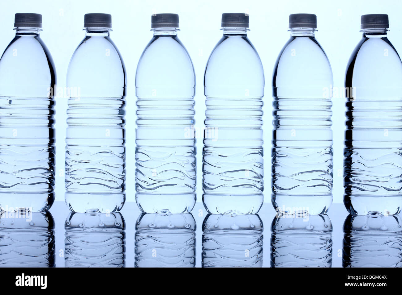 Bottles of water in row Stock Photo - Alamy
