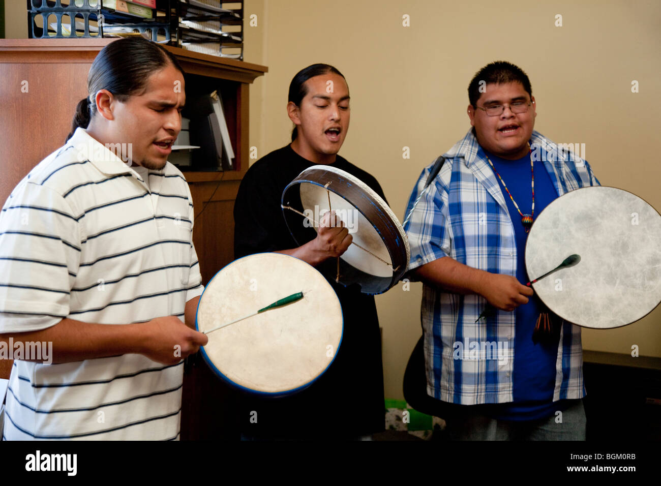 traditional drummers of the Klamath tribe play hand drums and sing ...