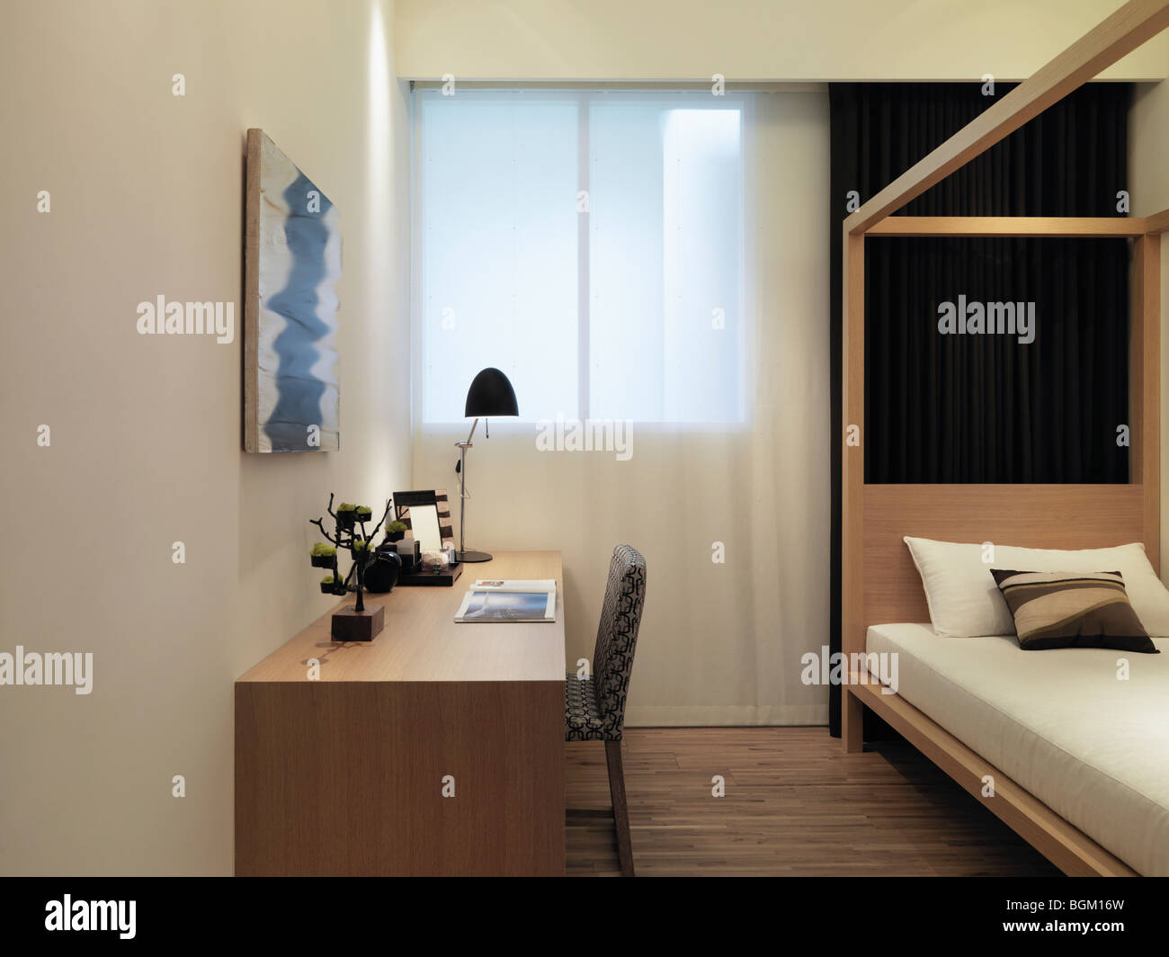 Small desk in modern bedroom Stock Photo - Alamy