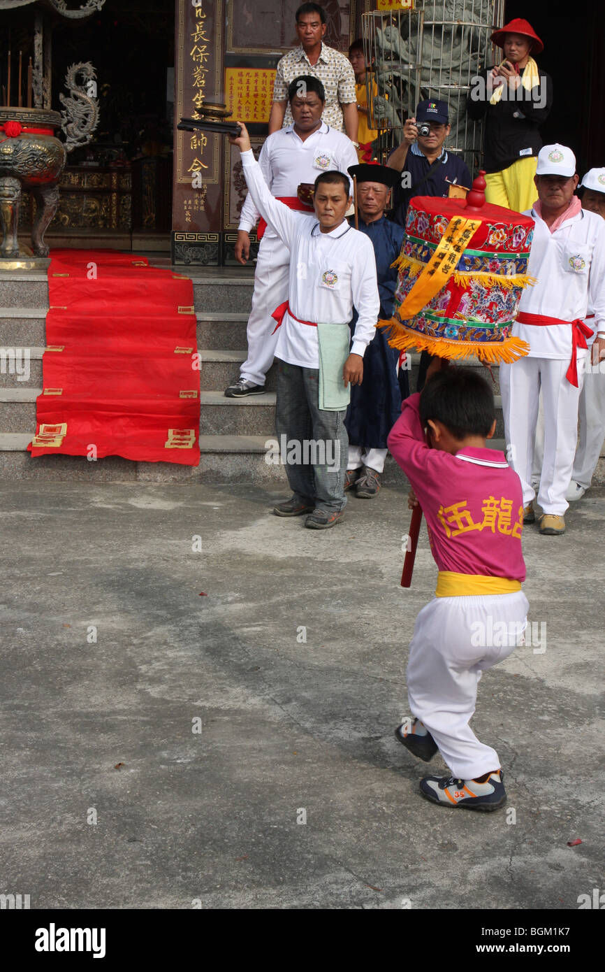 a boy doing a traditional dance front of a temple Stock Photo - Alamy