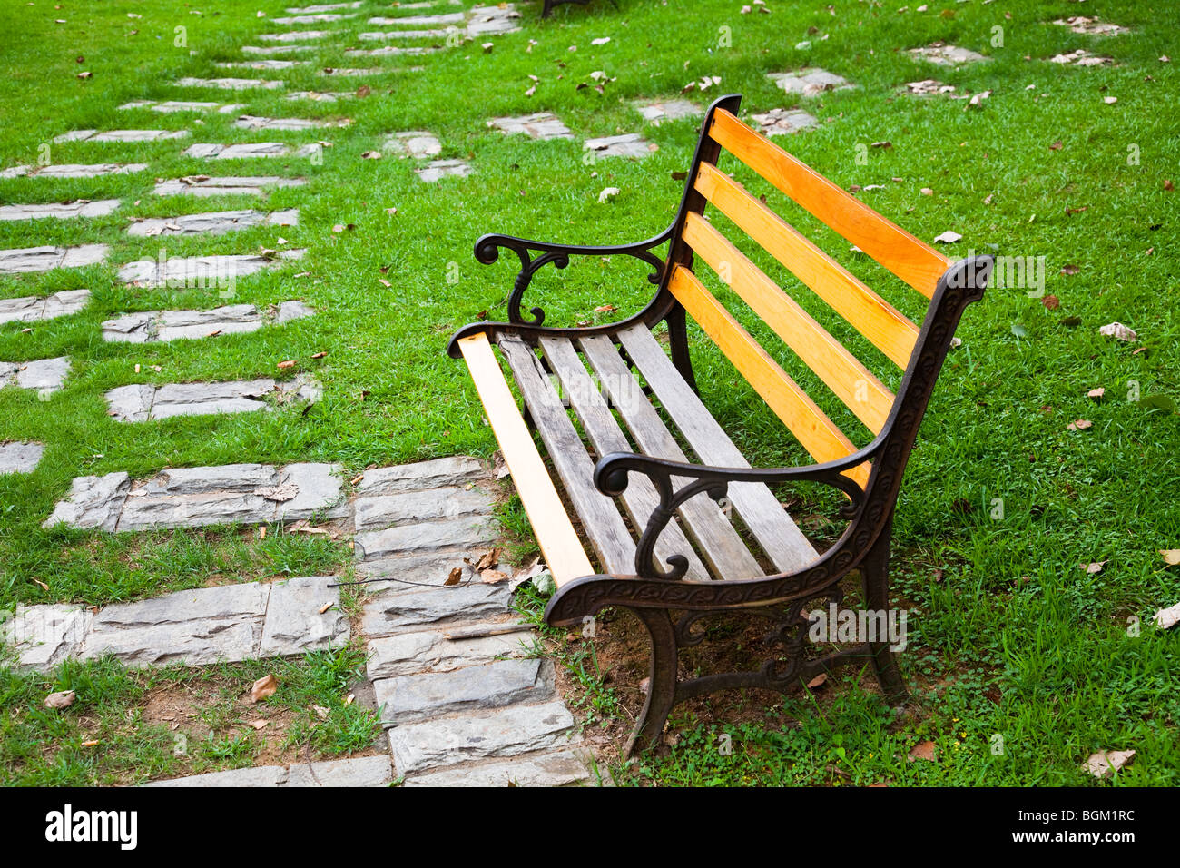footpath and bench in a garden,with green grass background Stock Photo ...