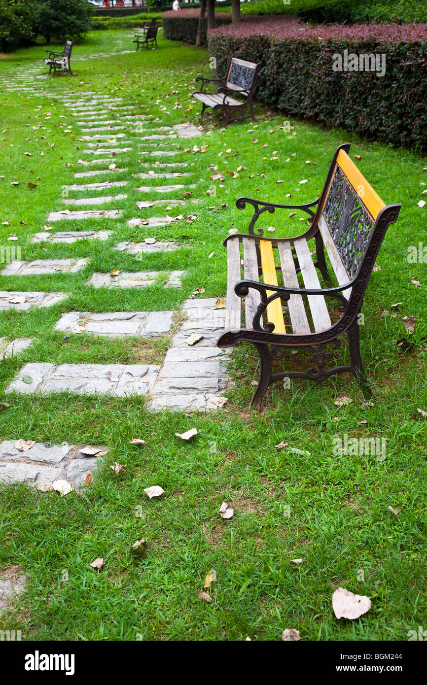 footpath and bench in a garden,with green grass background Stock Photo ...