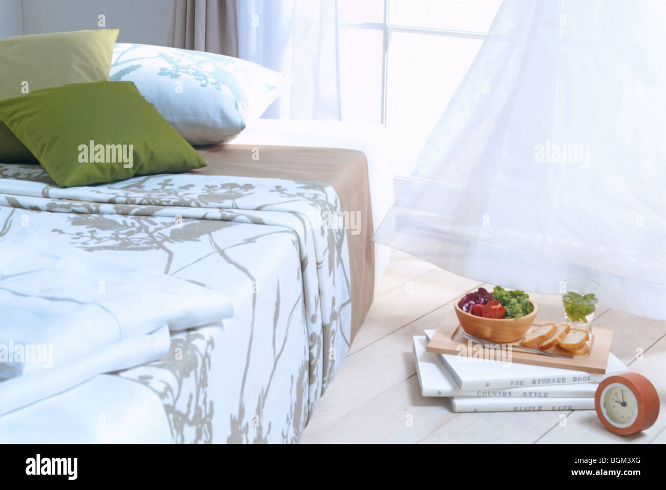 Bedroom with tray of food Stock Photo - Alamy