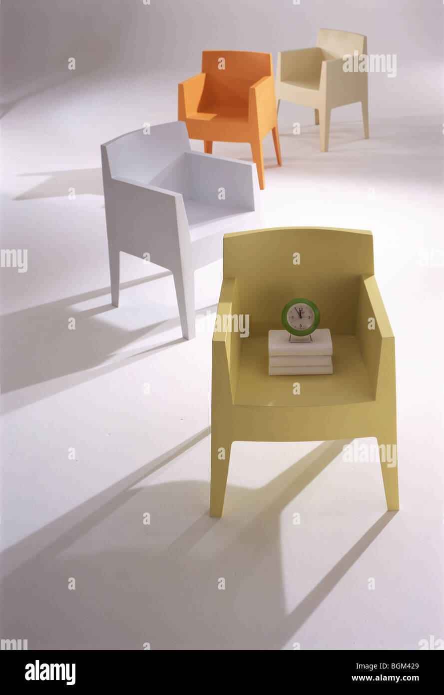 Four modern chairs in curve shape Stock Photo - Alamy