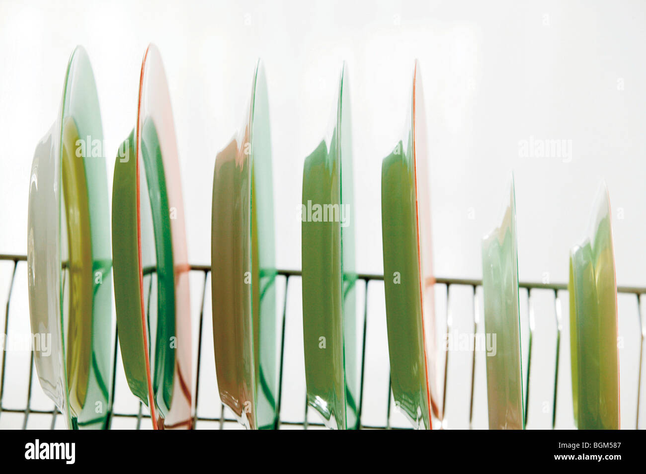 Plates drying on a dish rack Stock Photo - Alamy