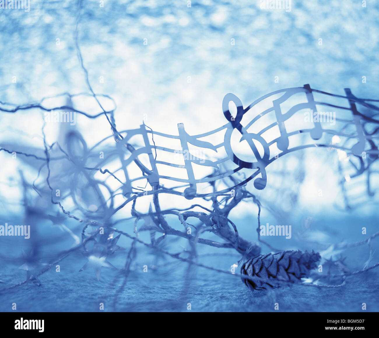 Musical note streamer with branch and a pine cone Stock Photo - Alamy