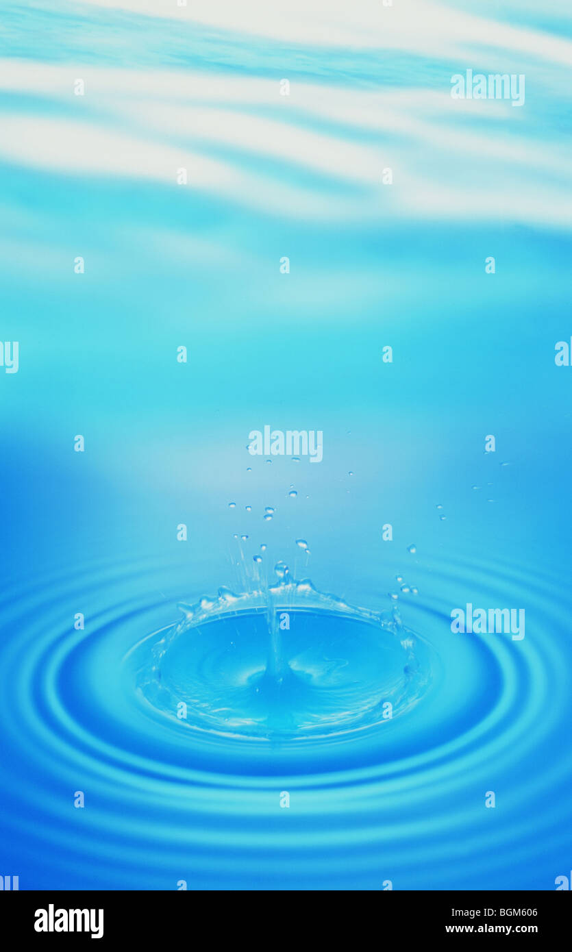 Waterdrop and ripples on water surface Stock Photo - Alamy