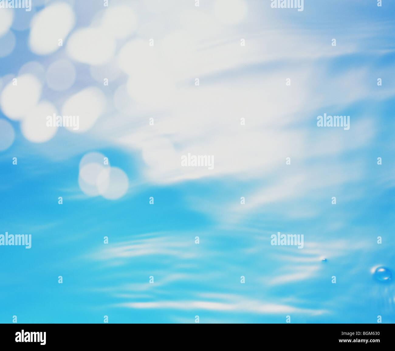 Rippled water surface with lens flare Stock Photo - Alamy