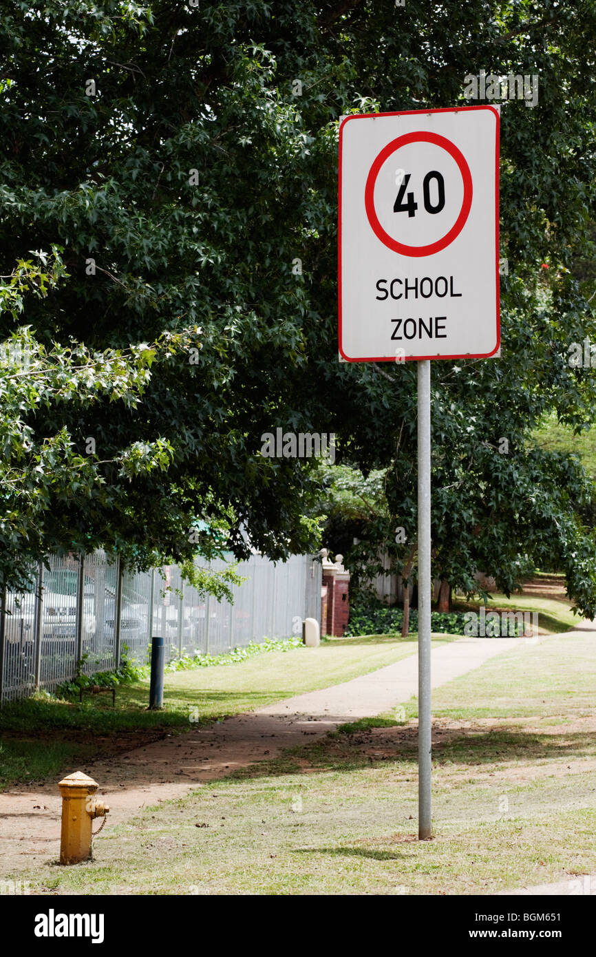 Road safety warning sign of restricted speed in school zone ...