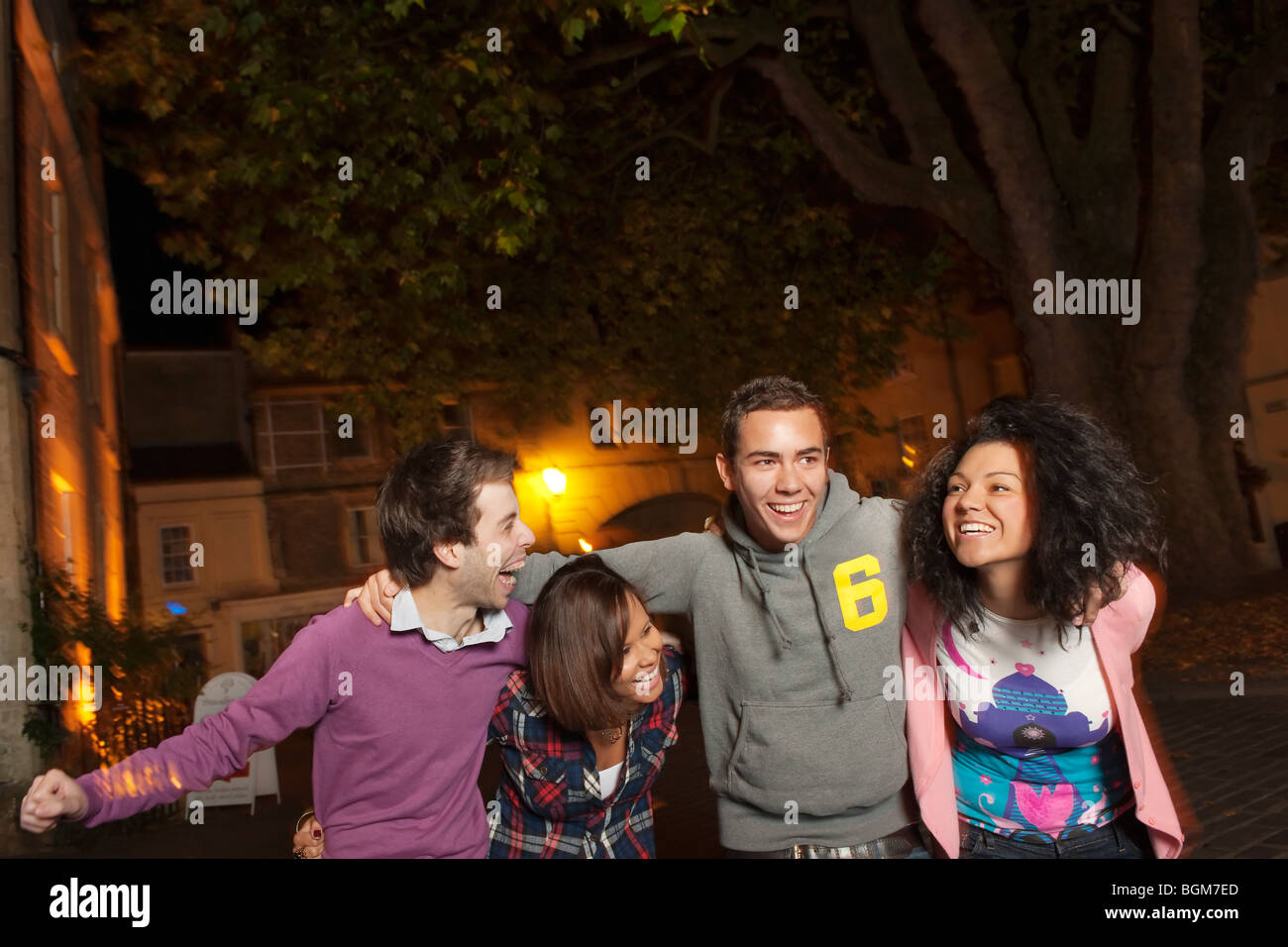 young people out at night in town Stock Photo - Alamy