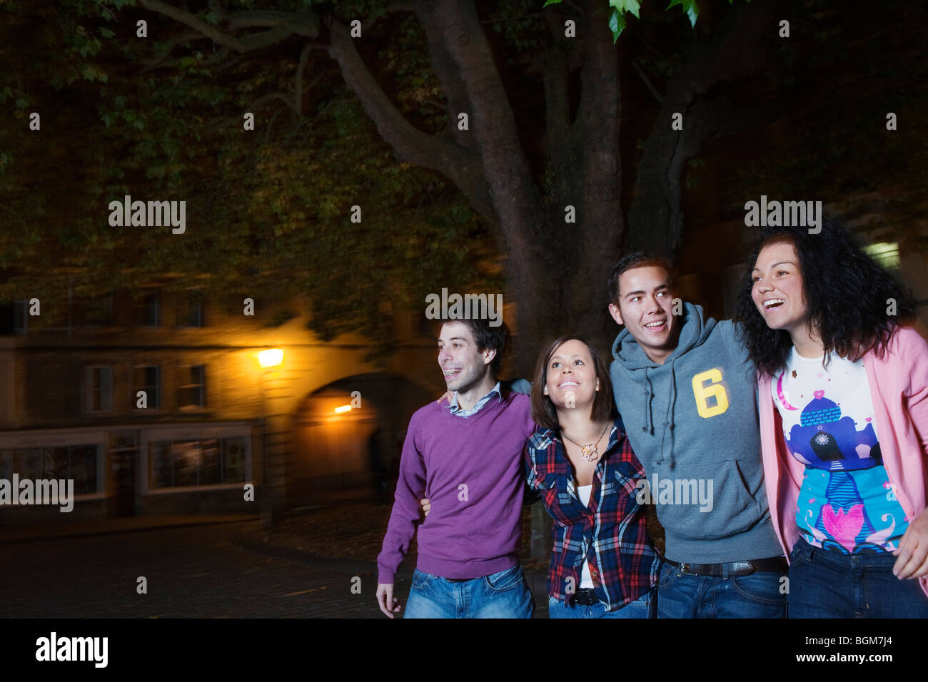 young people at night in town Stock Photo - Alamy