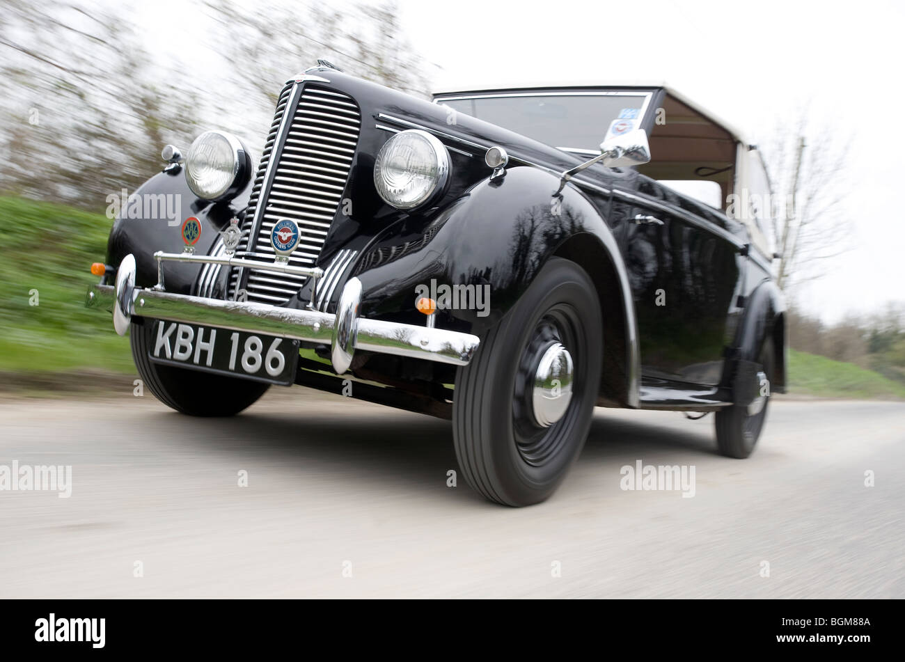 1939 Hillman Minx convertible driving on a country lane, British pre ...