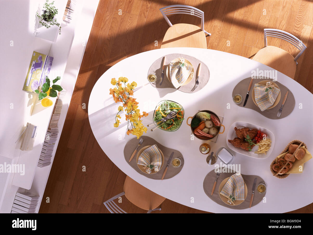 Dining table set for four Stock Photo - Alamy