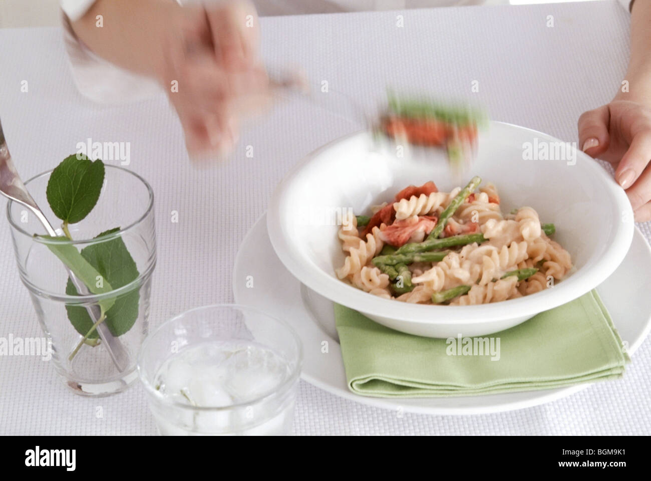 Person eating pasta meal Stock Photo - Alamy