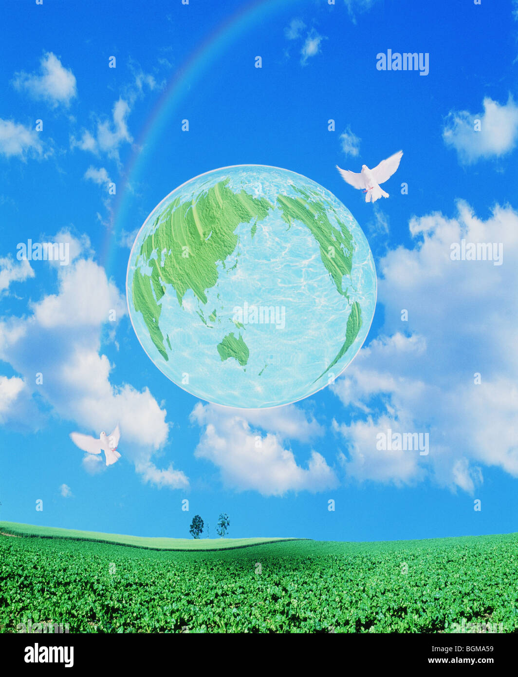 Earth and doves floating over green field Stock Photo - Alamy