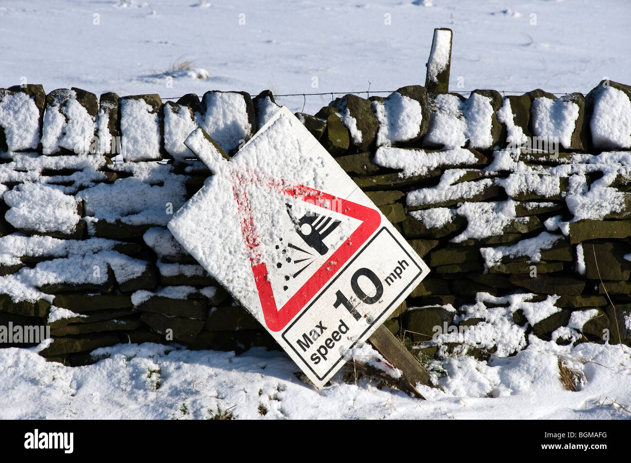 Warning sign with snow Stock Photo - Alamy