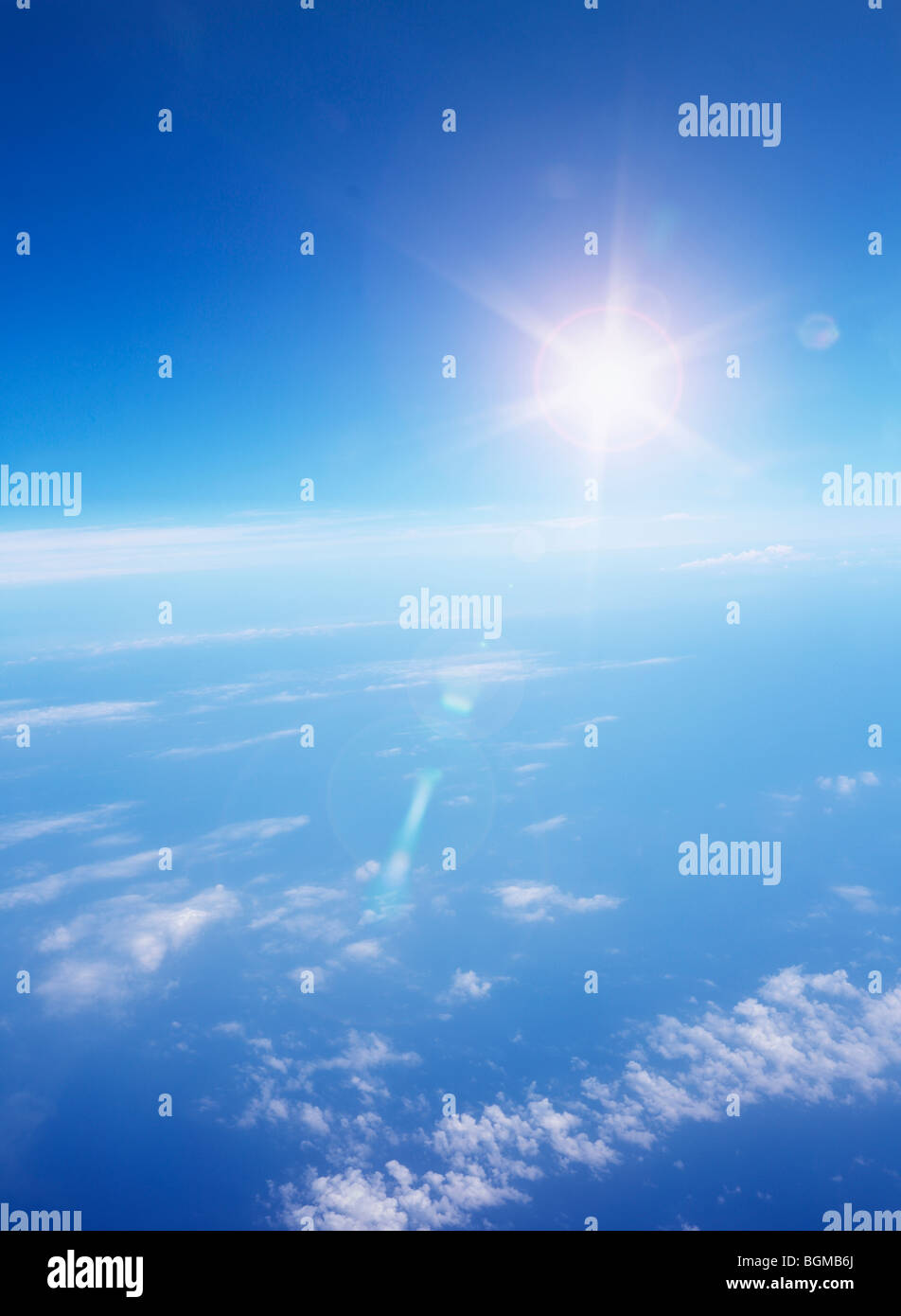 Sun shining in blue sky Stock Photo - Alamy