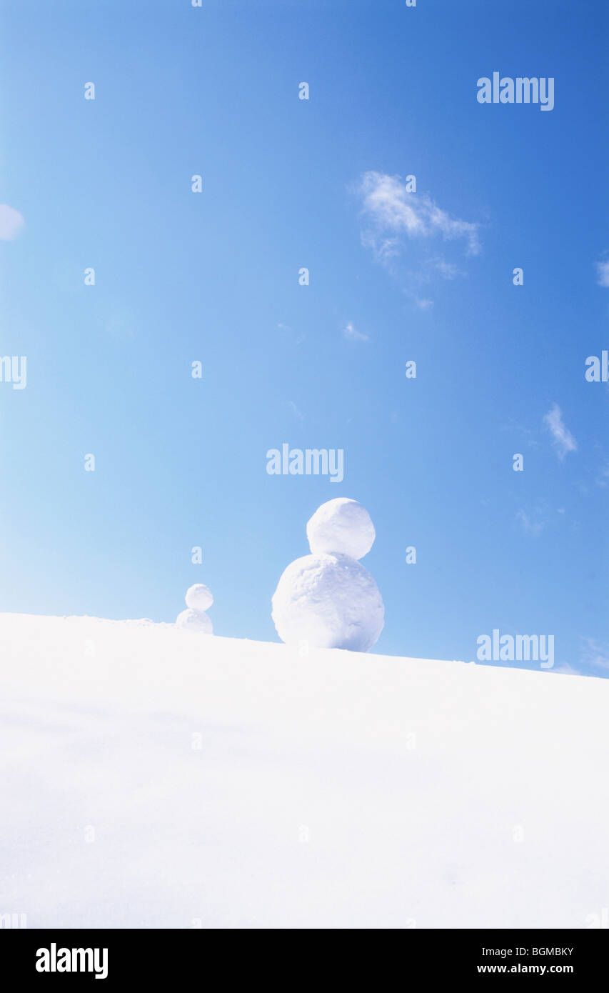 Two people with snowmen hi-res stock photography and images - Alamy