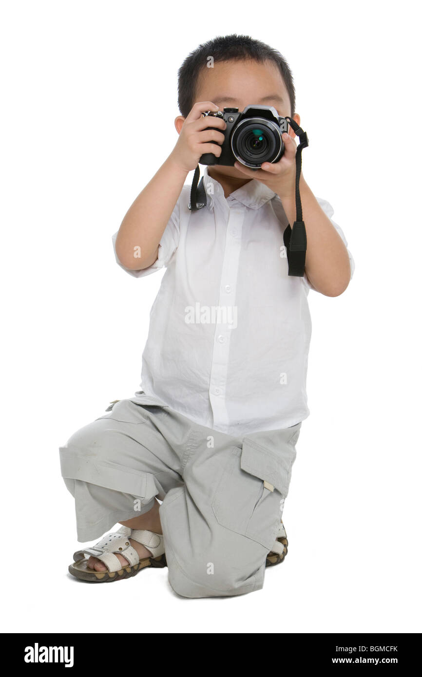 Little boy taking photo by digital camera Stock Photo - Alamy