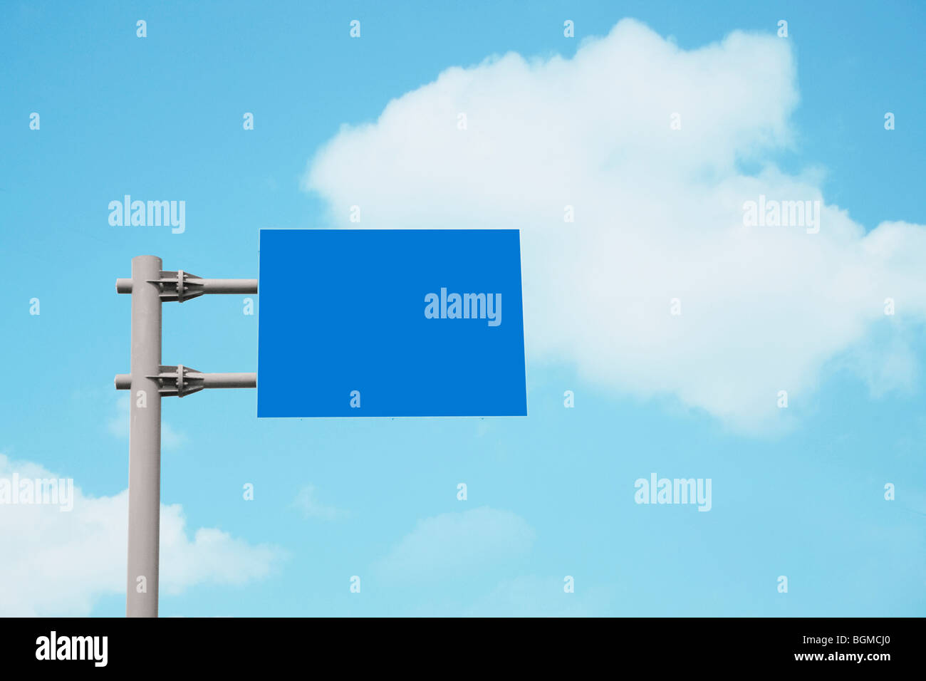 Blank blue signpost under clouds Stock Photo - Alamy
