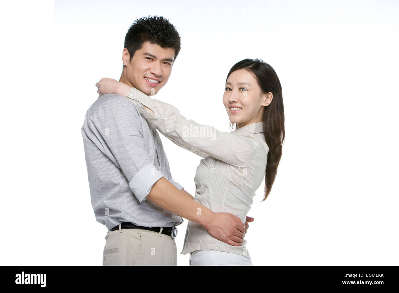 Young couple holding each other Stock Photo - Alamy