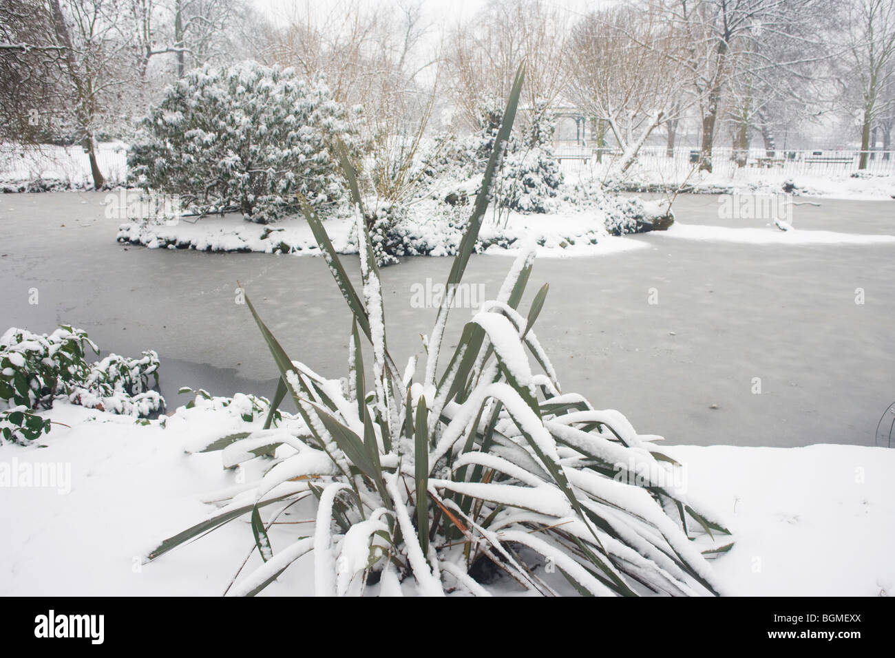 A frozen and snowbound landscape overlooking the Edwardian pond in ...