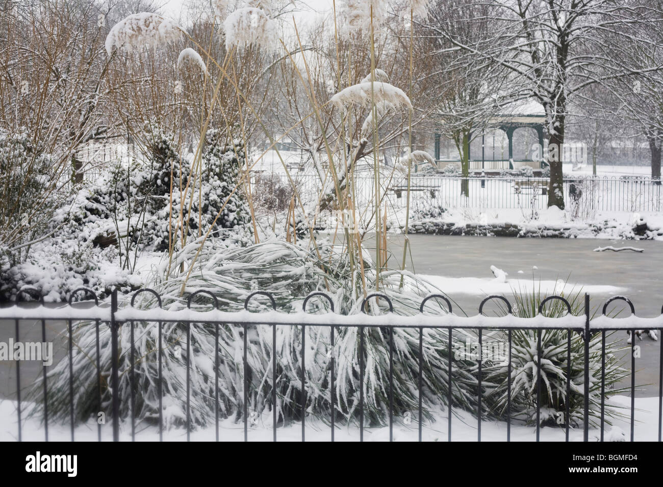 A frozen and snowbound landscape overlooking the Edwardian pond in ...