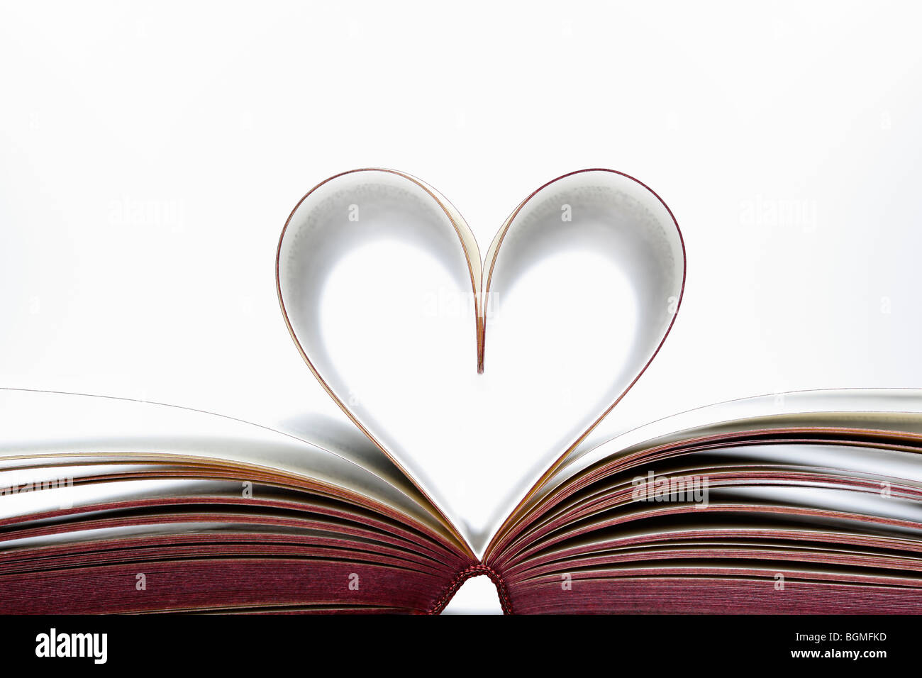Book pages heart shaped Stock Photo - Alamy