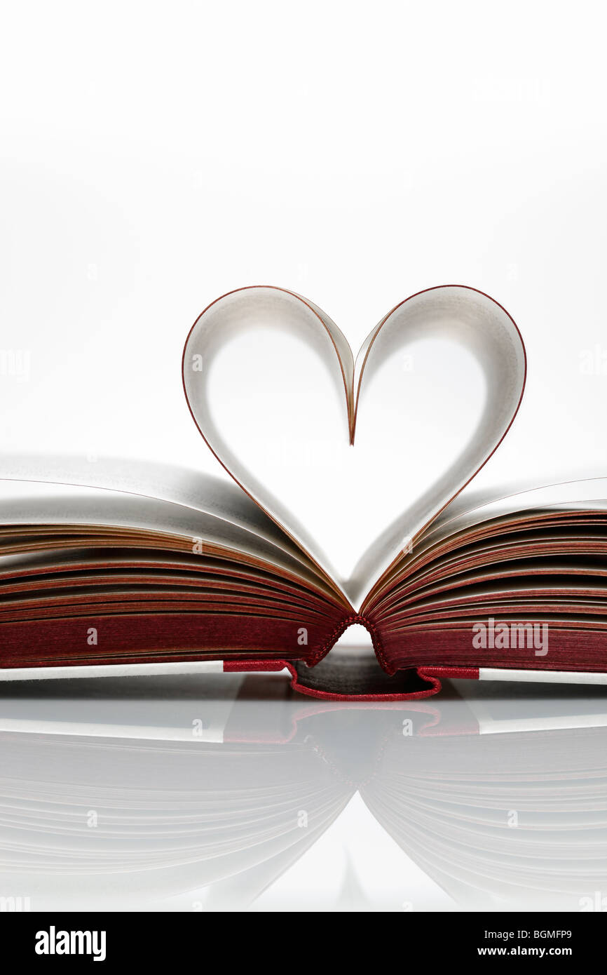 Book pages heart shaped Stock Photo - Alamy