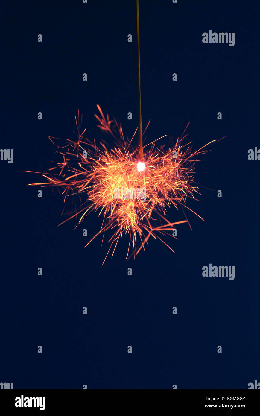 Sparkler firework in midnight blue sky Stock Photo - Alamy