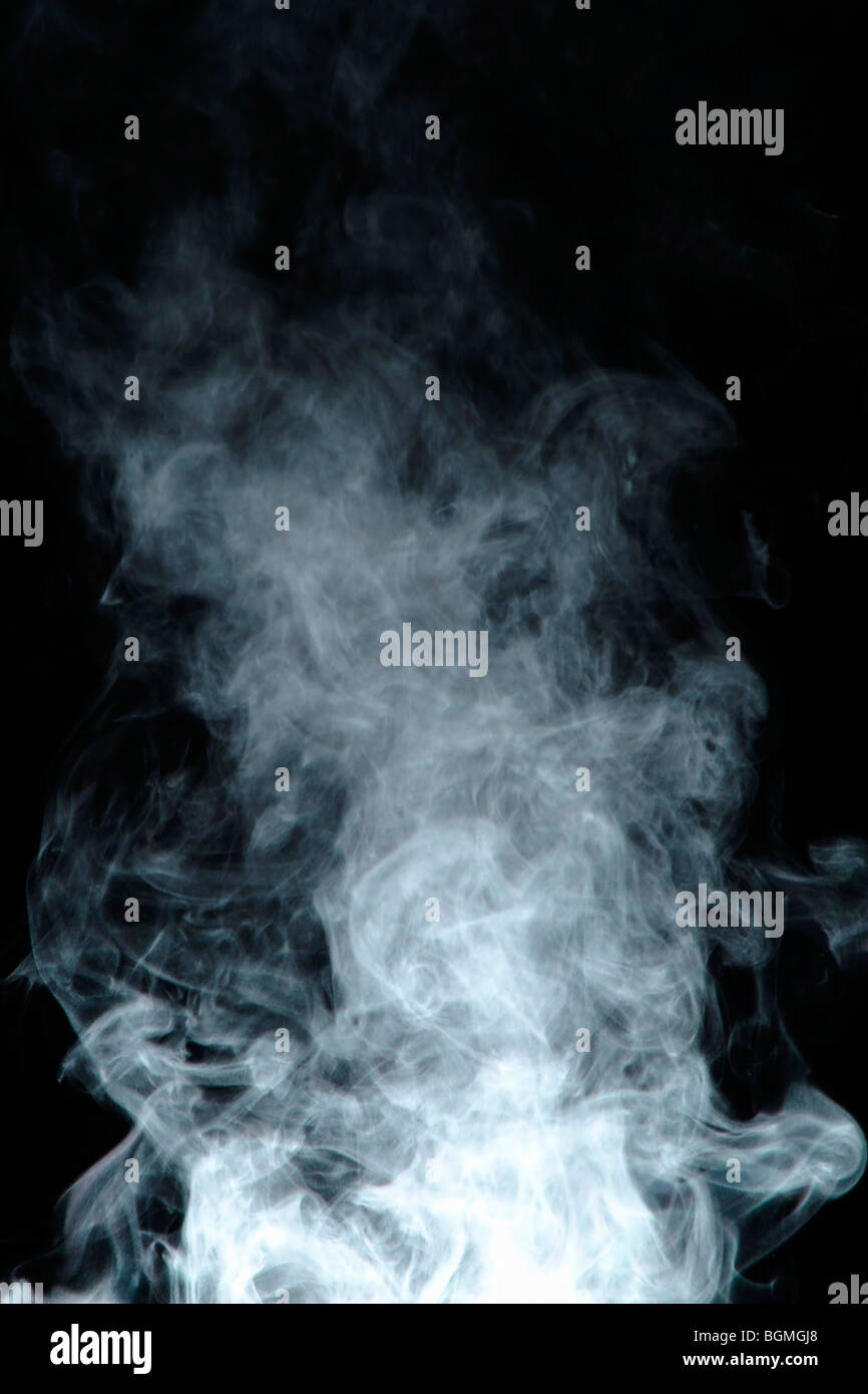 Steam rising against black background Stock Photo - Alamy