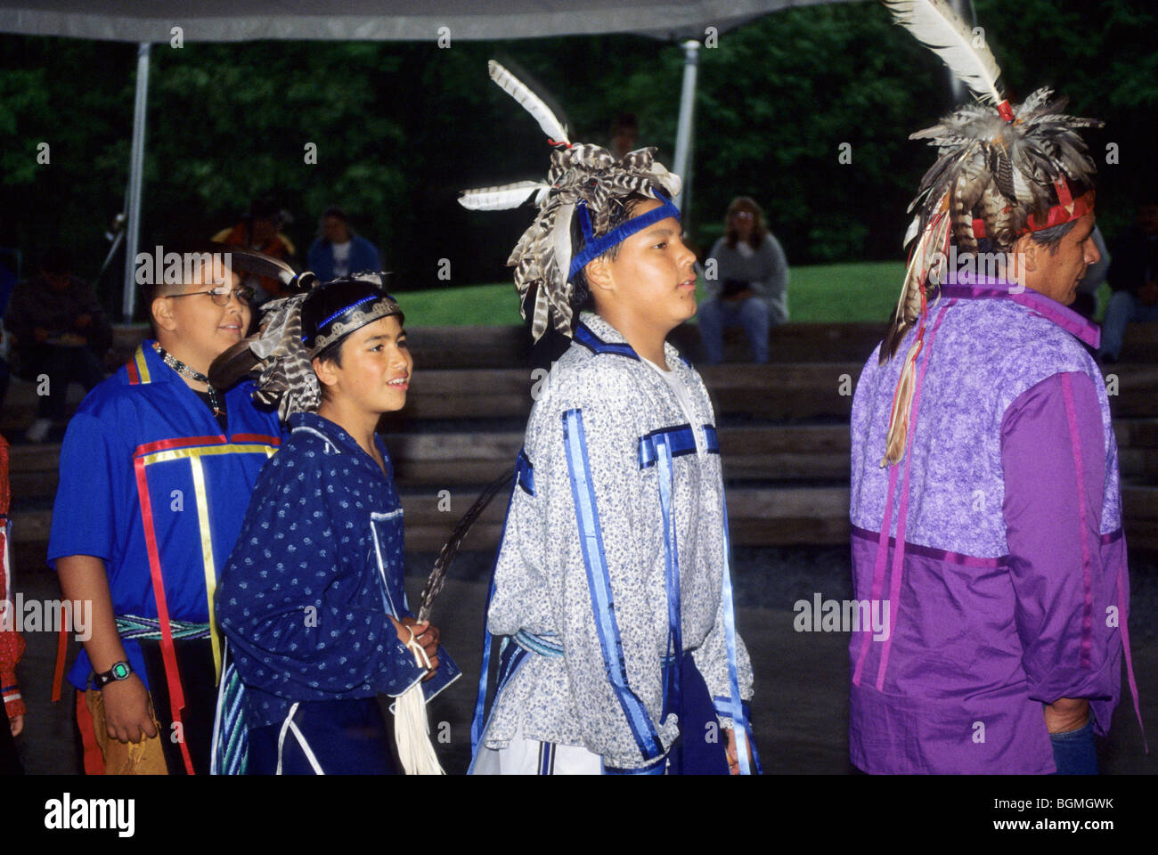 Four Iroquois male dancers dressed in traditional gustoweh feather ...