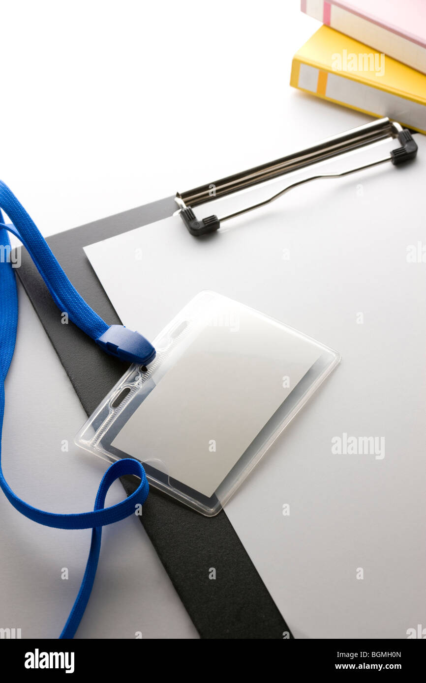 ID card on clipboard next to files Stock Photo - Alamy