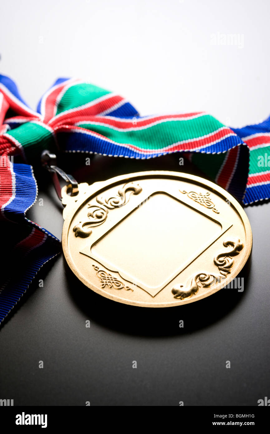 Gold medal with colorful ribbon Stock Photo - Alamy