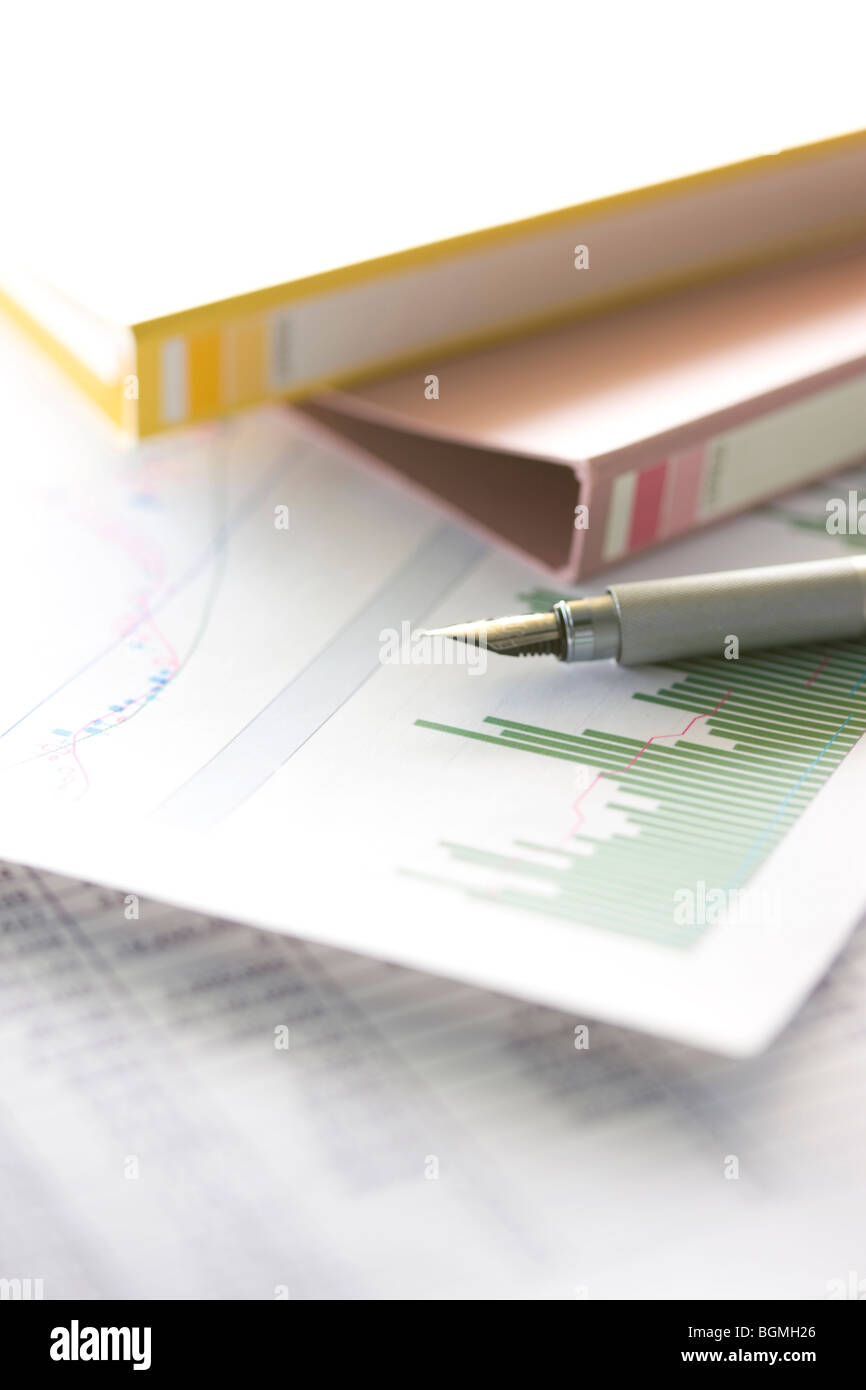 Calligraphy pen files and documents with graphs Stock Photo - Alamy