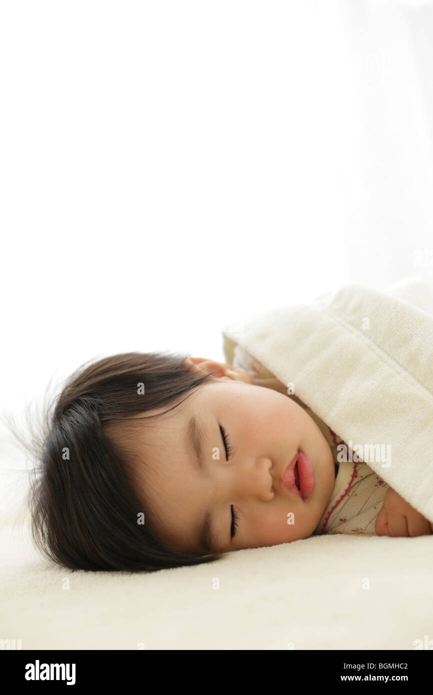 Baby taking a nap Stock Photo - Alamy