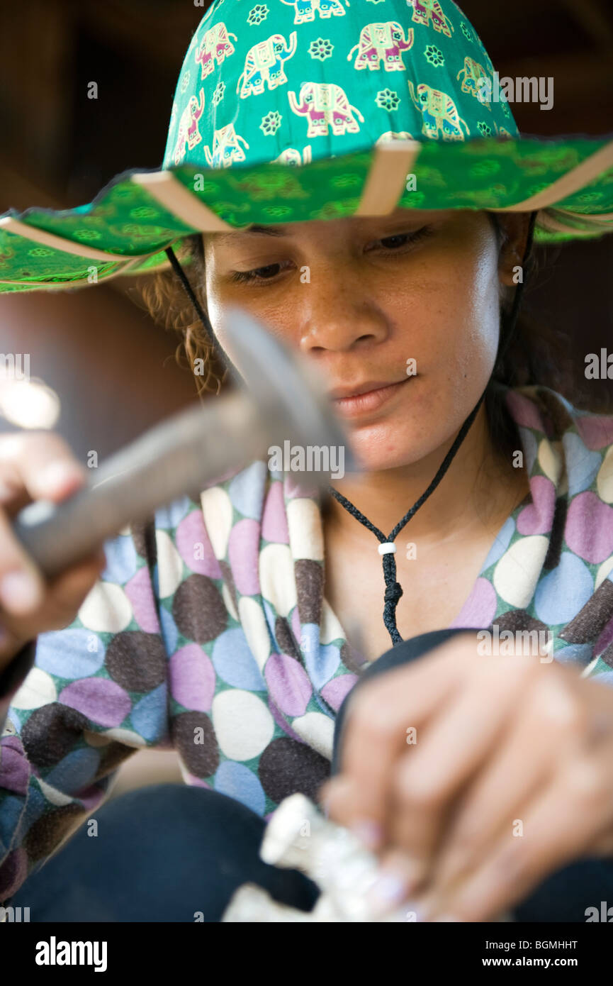 A silver worker silversmith outside the capital of Phnom Penh in ...