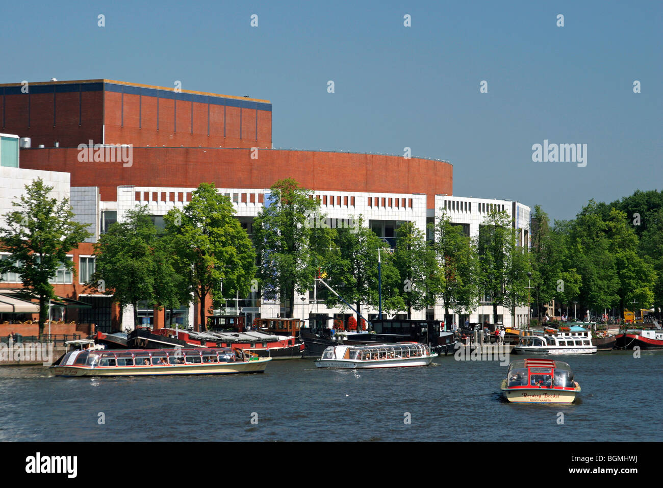 Round-trip boats in front of the Stopera (town hall and opera ...